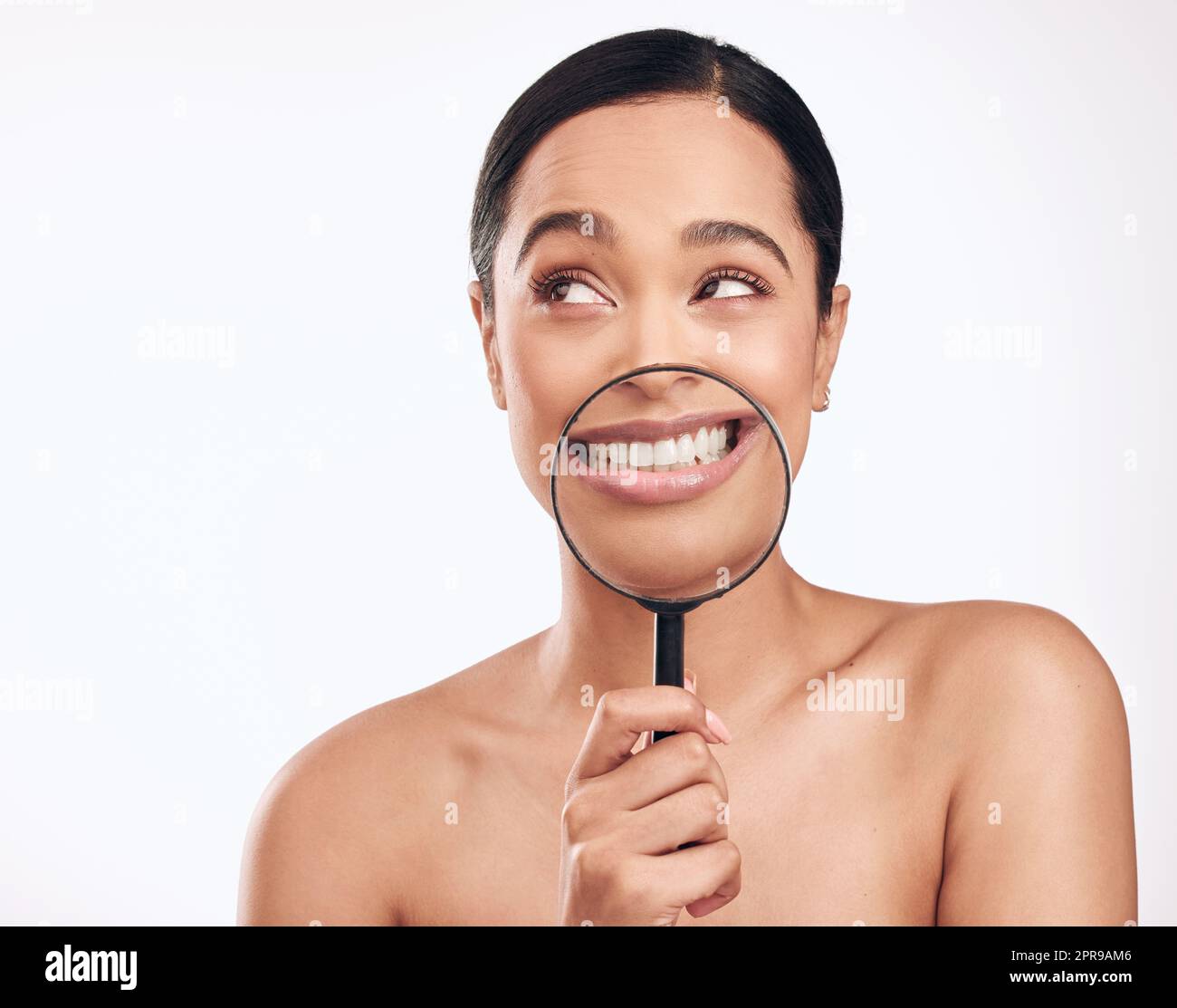 Its your smile that draws people in. a beautiful young woman holding a ...