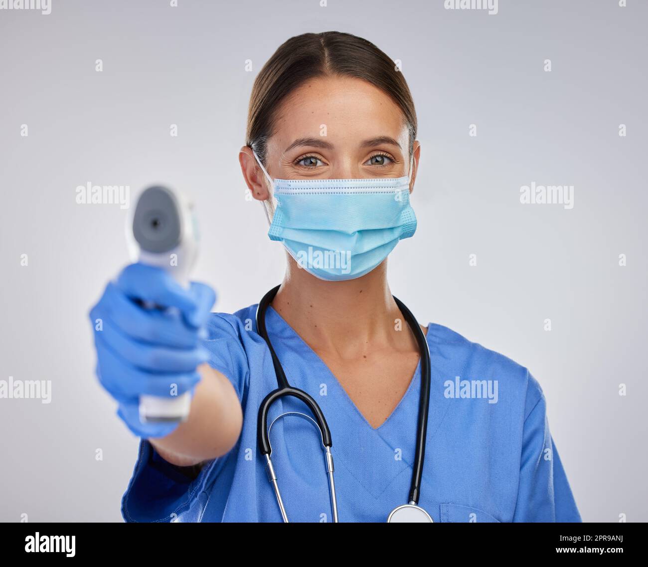 Checking your temperature could save you. a young female nurse holding ...
