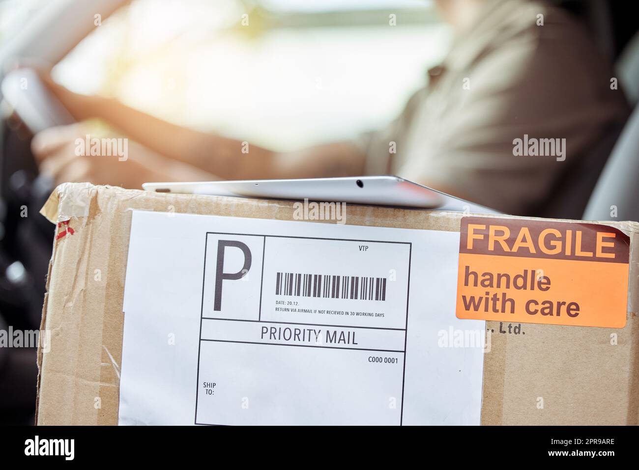 Another shipment ready to be delivered. a delivery man driving to drop ...