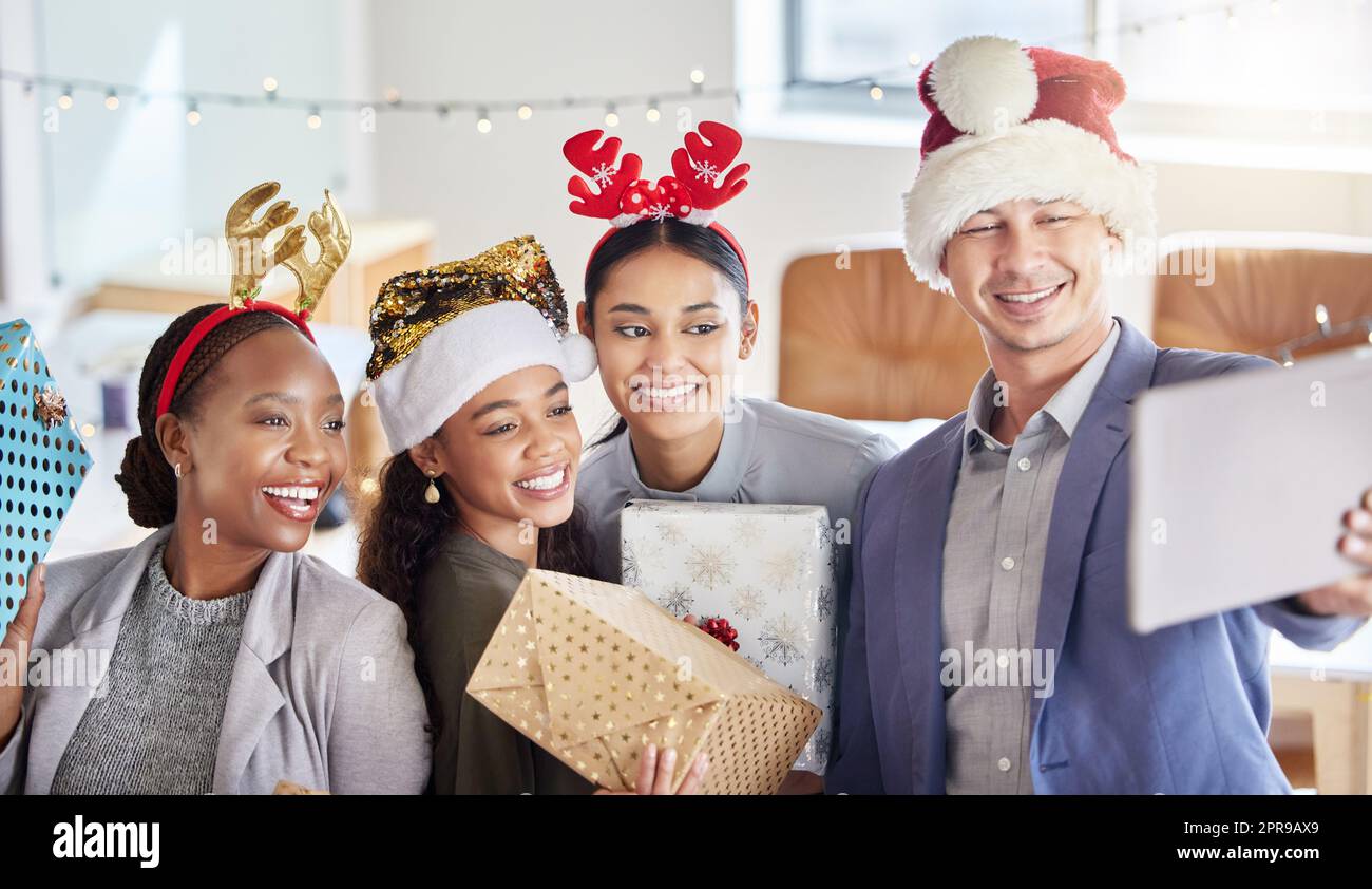 Getting into the Christmas spirit at the office. a group of colleagues ...