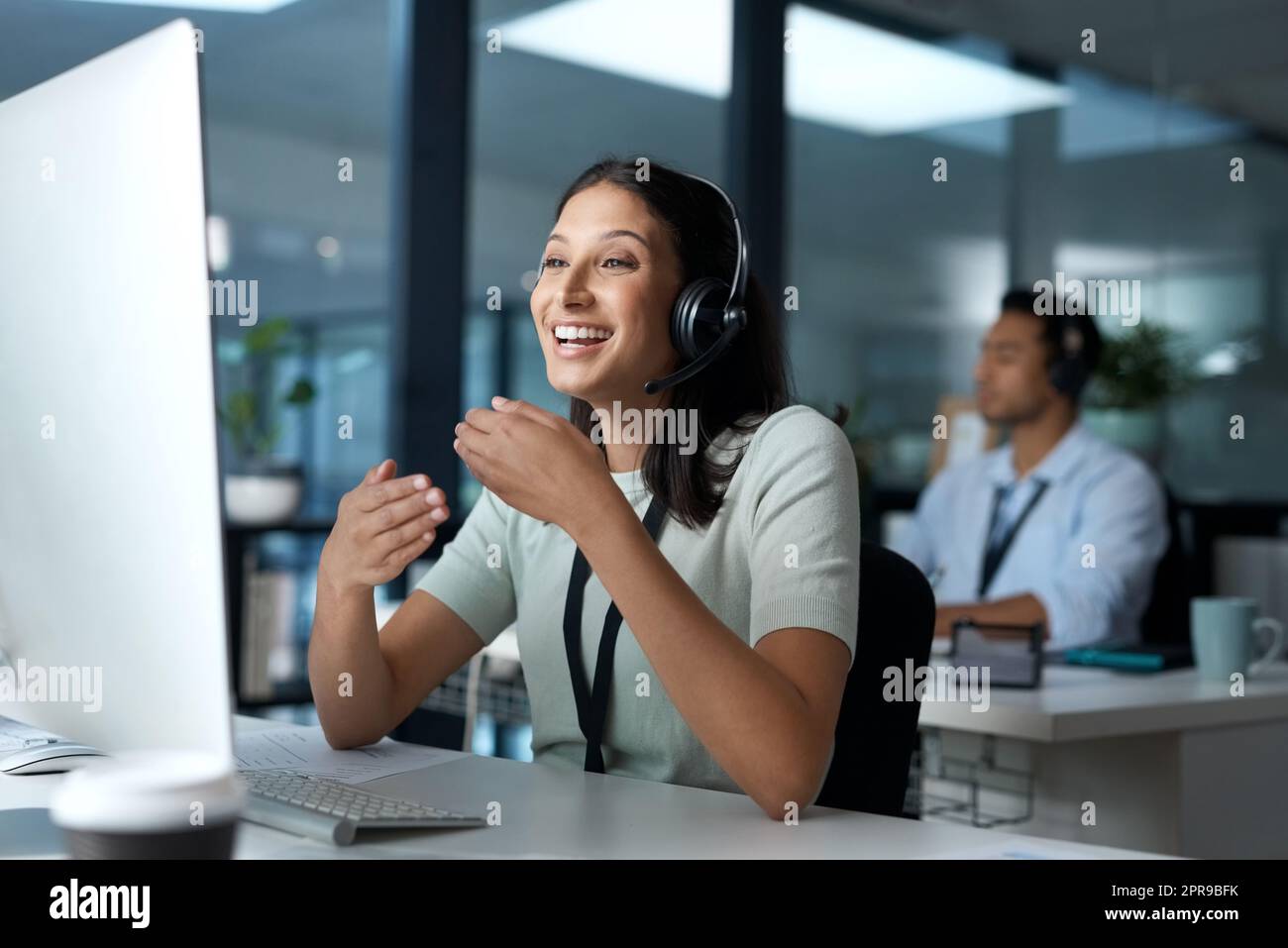 Customer support you can get excited about. a young woman using a ...