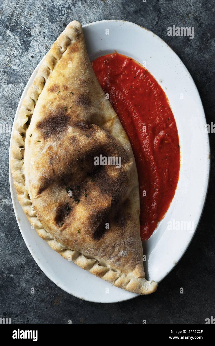 italian calzone folded pizza Stock Photo - Alamy