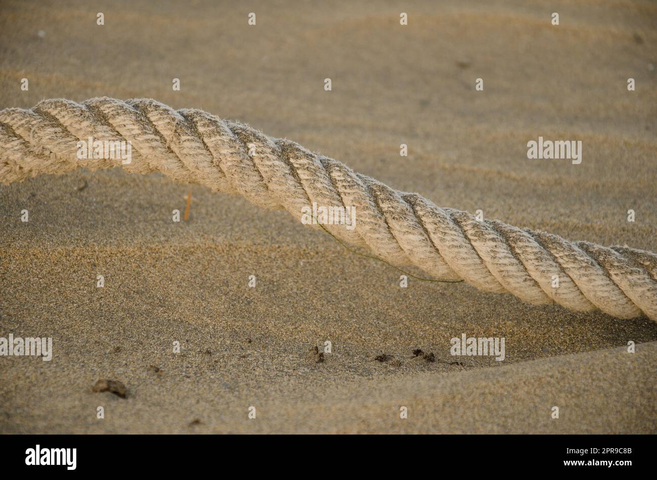 Rope in the sand Stock Photo - Alamy