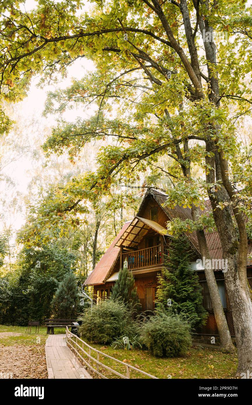 Tourist Guest House For Rest. Wooden House In Forest In Autumn Sunny ...