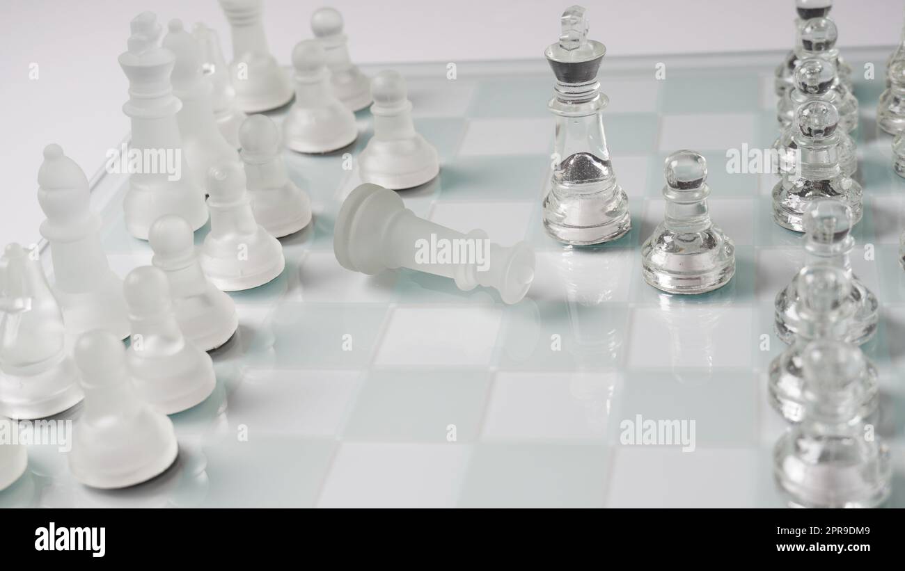 Transparent chess figures, on starting position, on reflective chess ...
