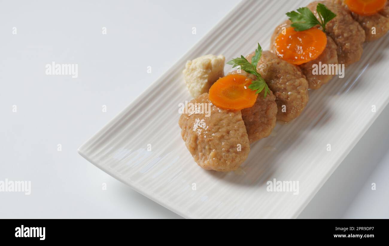 Traditional Jewish Passover food gefilte fish with carrots, horseradish ...