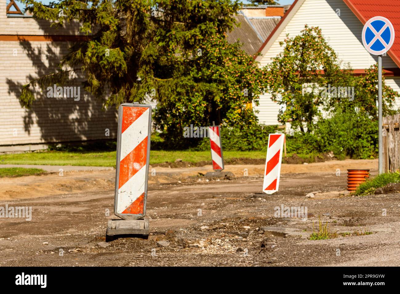 Red and white striped traffic control devices for avoiding sections of ...