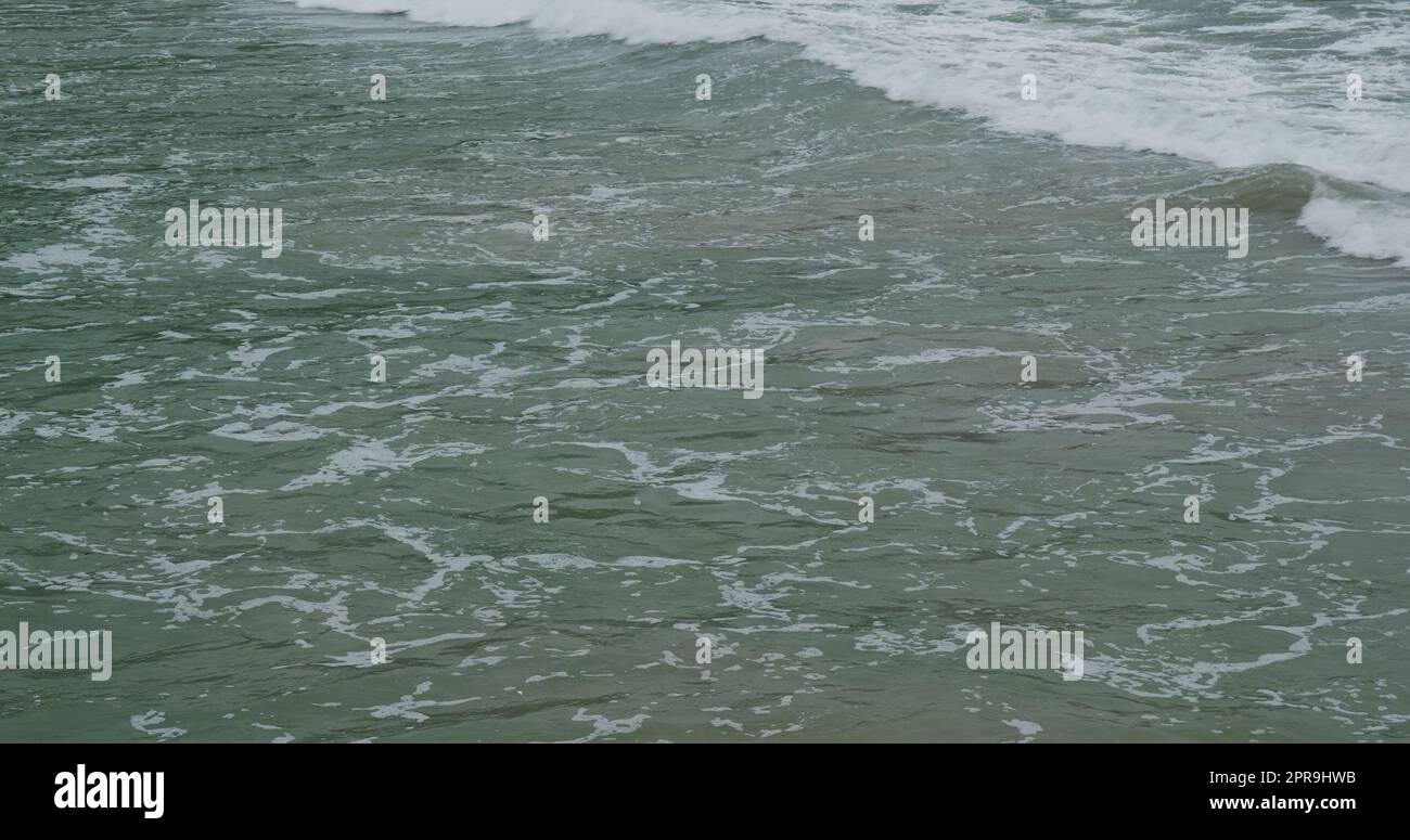 Sea wave splash on the beach Stock Photo - Alamy