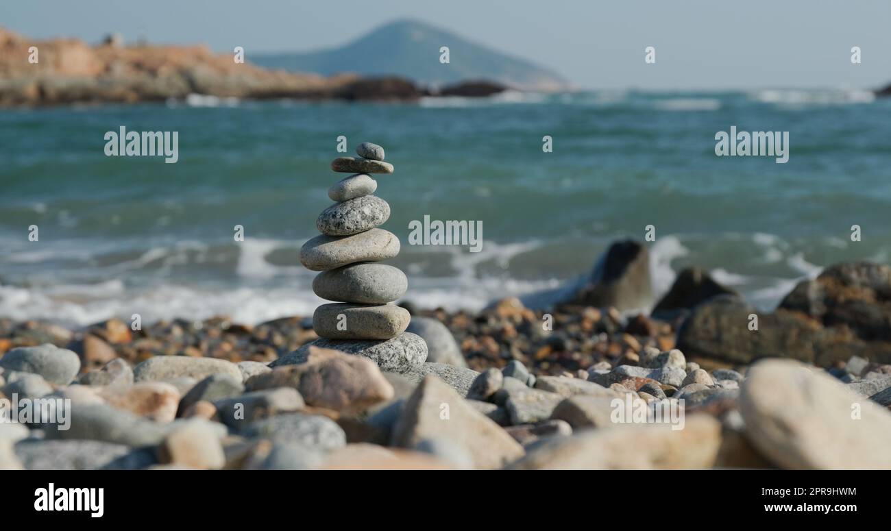 Balanced Pebble stone at beach Stock Photo - Alamy