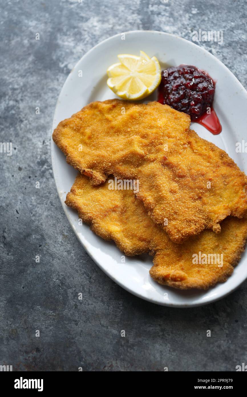 golden breaded german schnitzel Stock Photo - Alamy