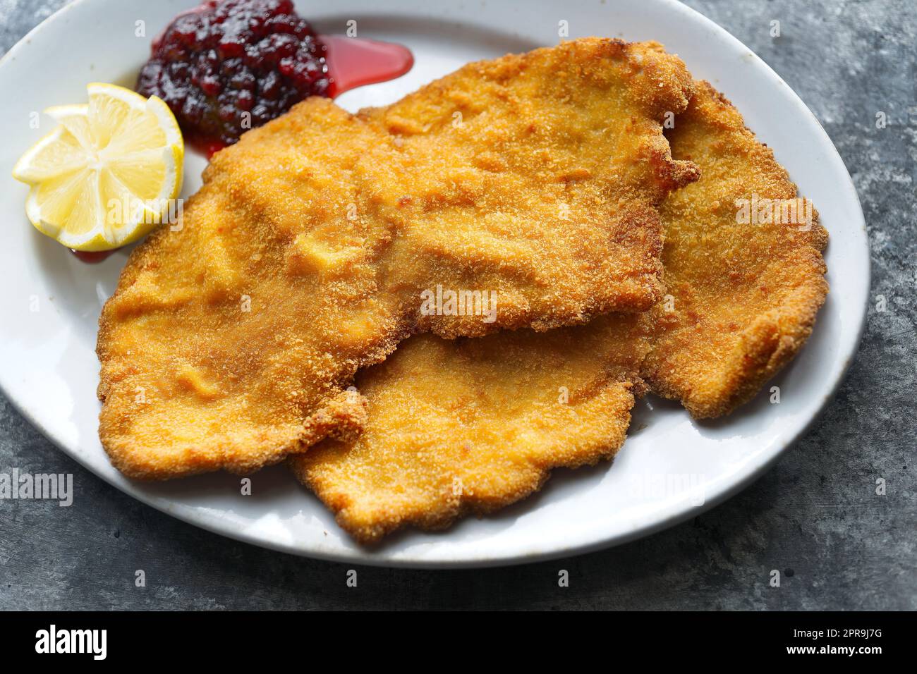 golden breaded german schnitzel Stock Photo - Alamy