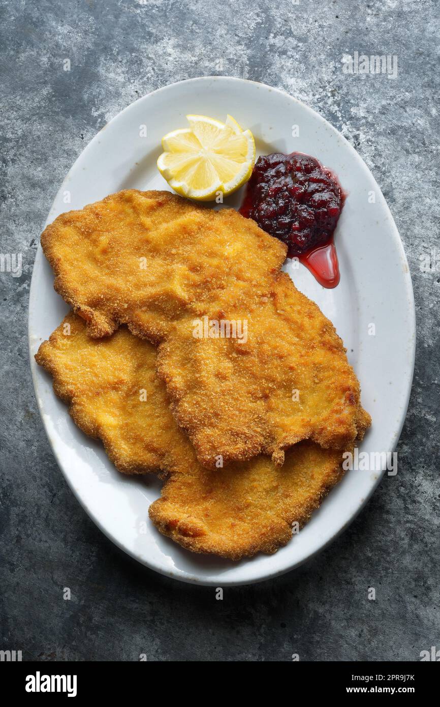 golden breaded german schnitzel Stock Photo - Alamy