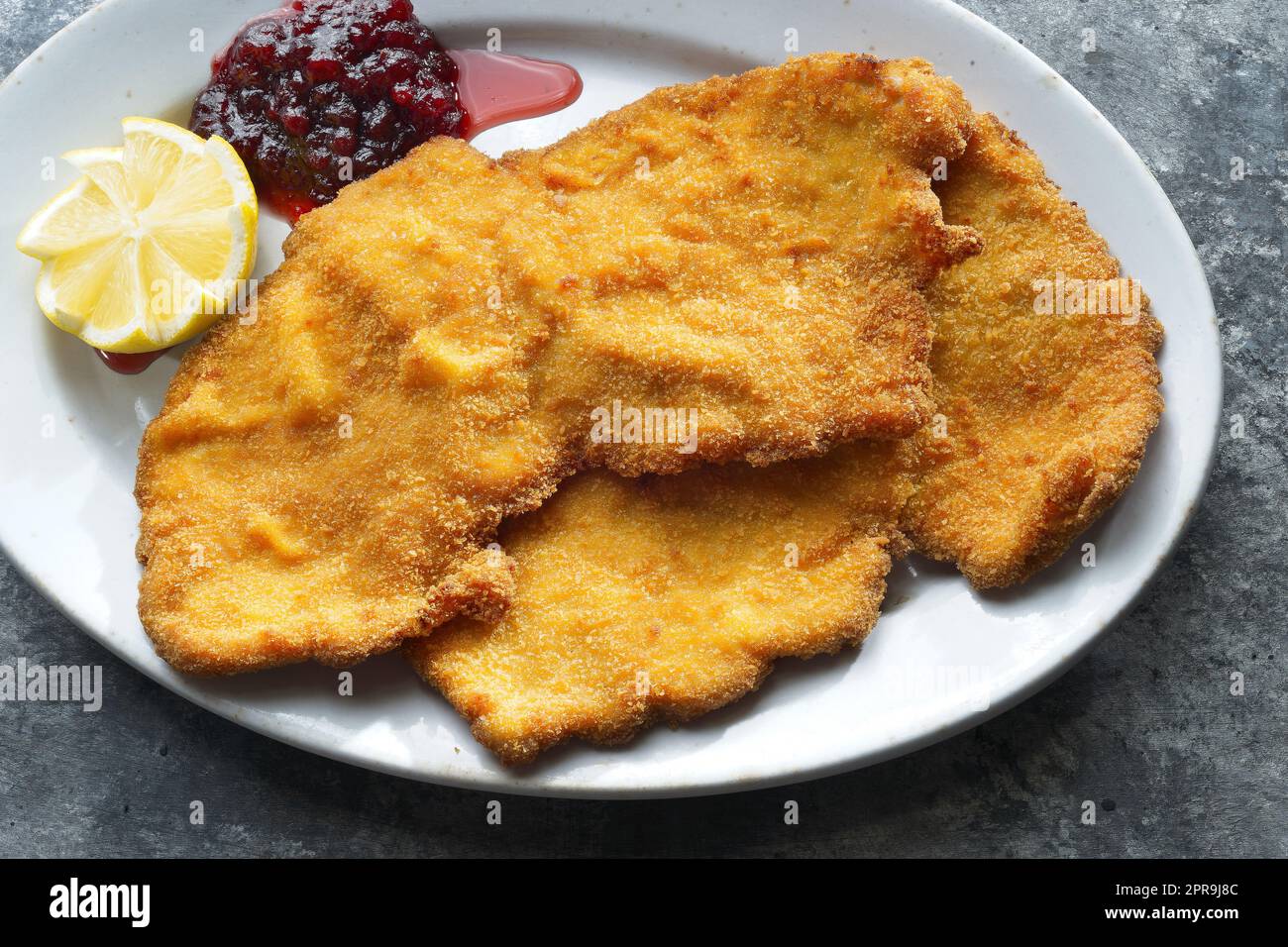 golden breaded german schnitzel Stock Photo - Alamy