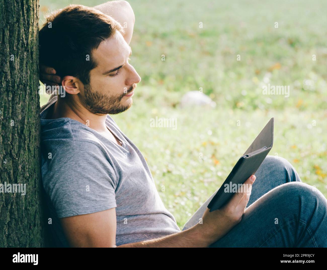 Man using book reader hi-res stock photography and images - Alamy
