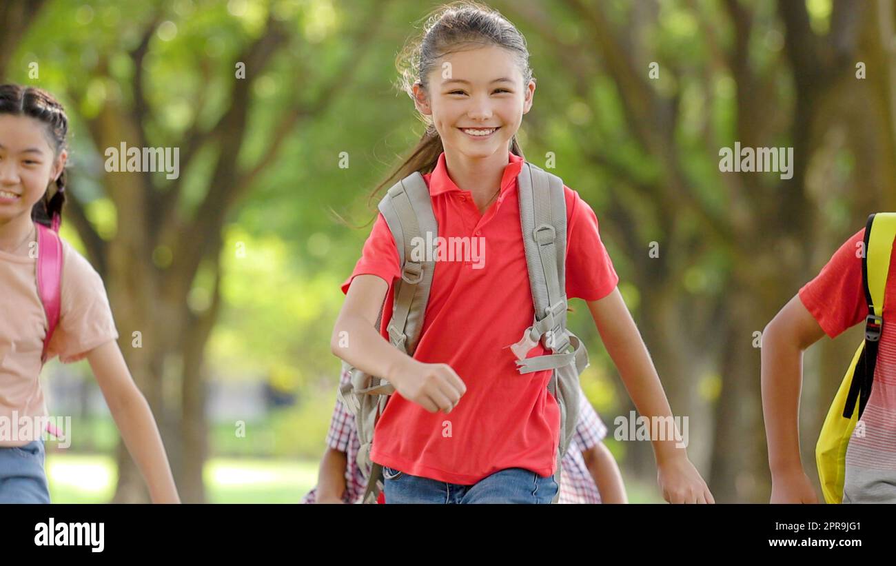 Happy elementary school kids running at school. back to school Stock ...