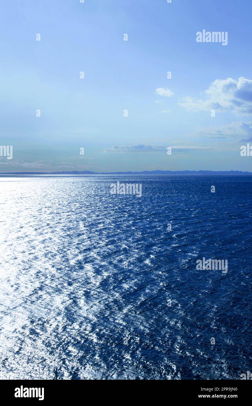 A view of the wide sea in the morning that sparkles in the sunlight ...