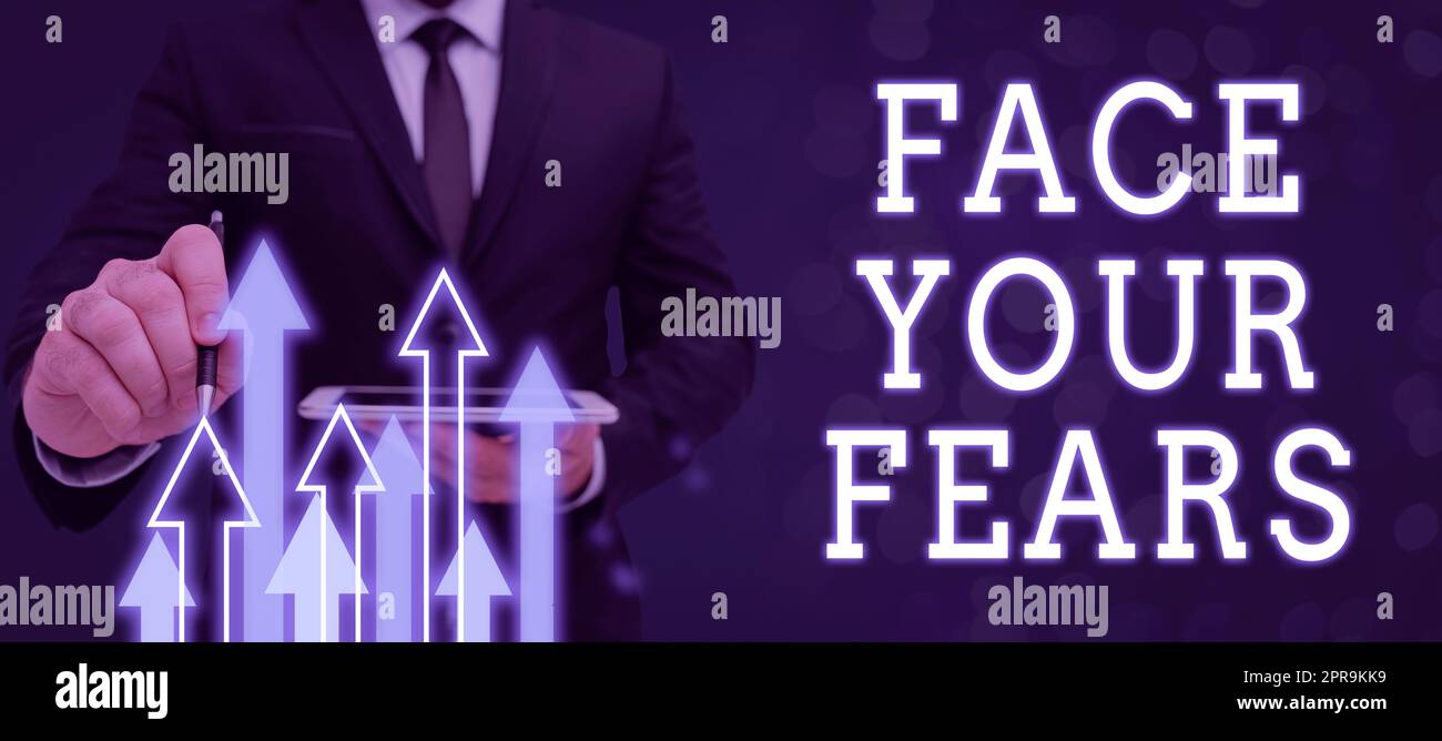 Hand writing sign Face Your Fears. Concept meaning Have the courage to ...