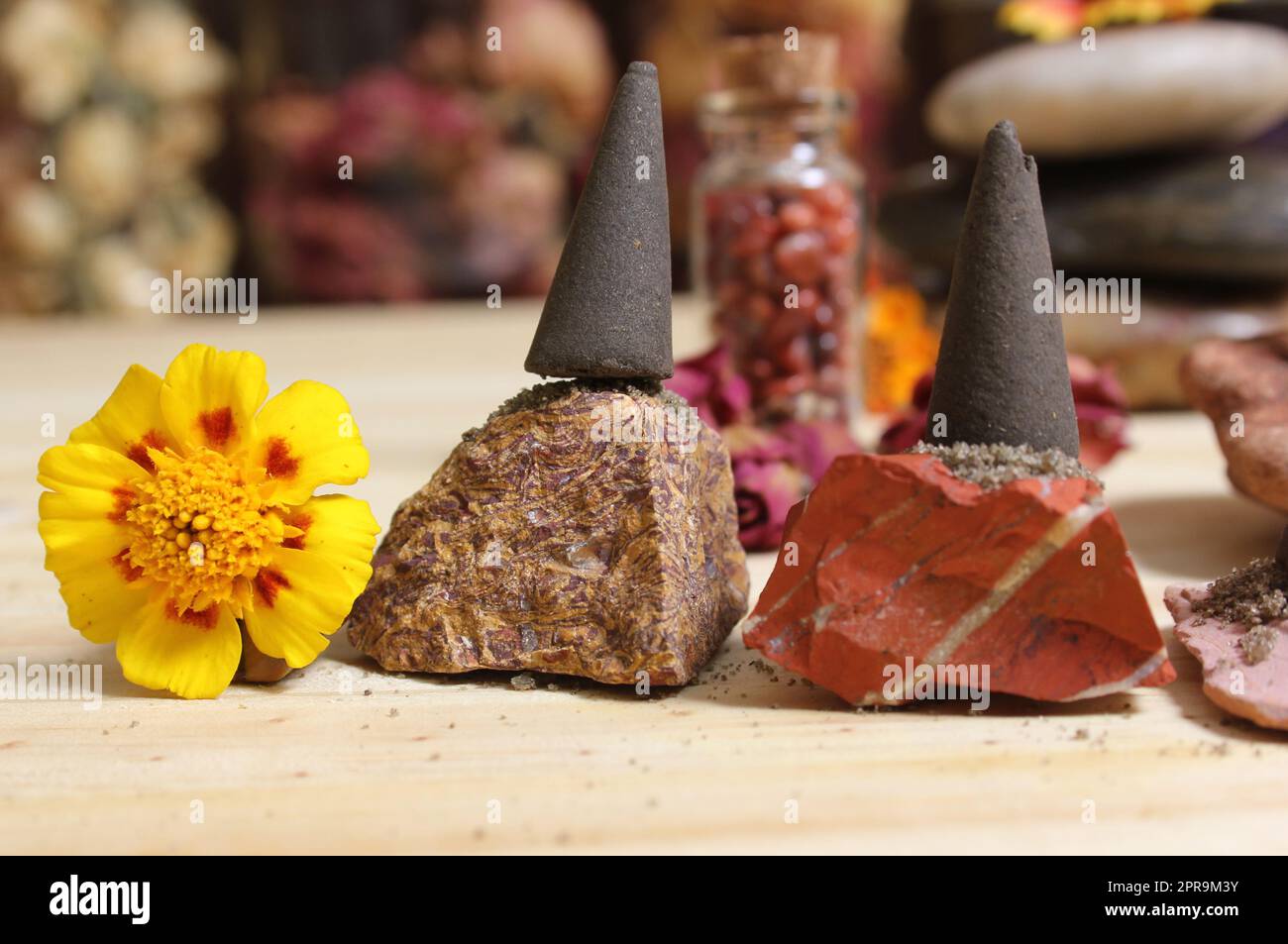 Incense Cones and Desert Rose Rocks on Meditation Table Stock Photo - Alamy