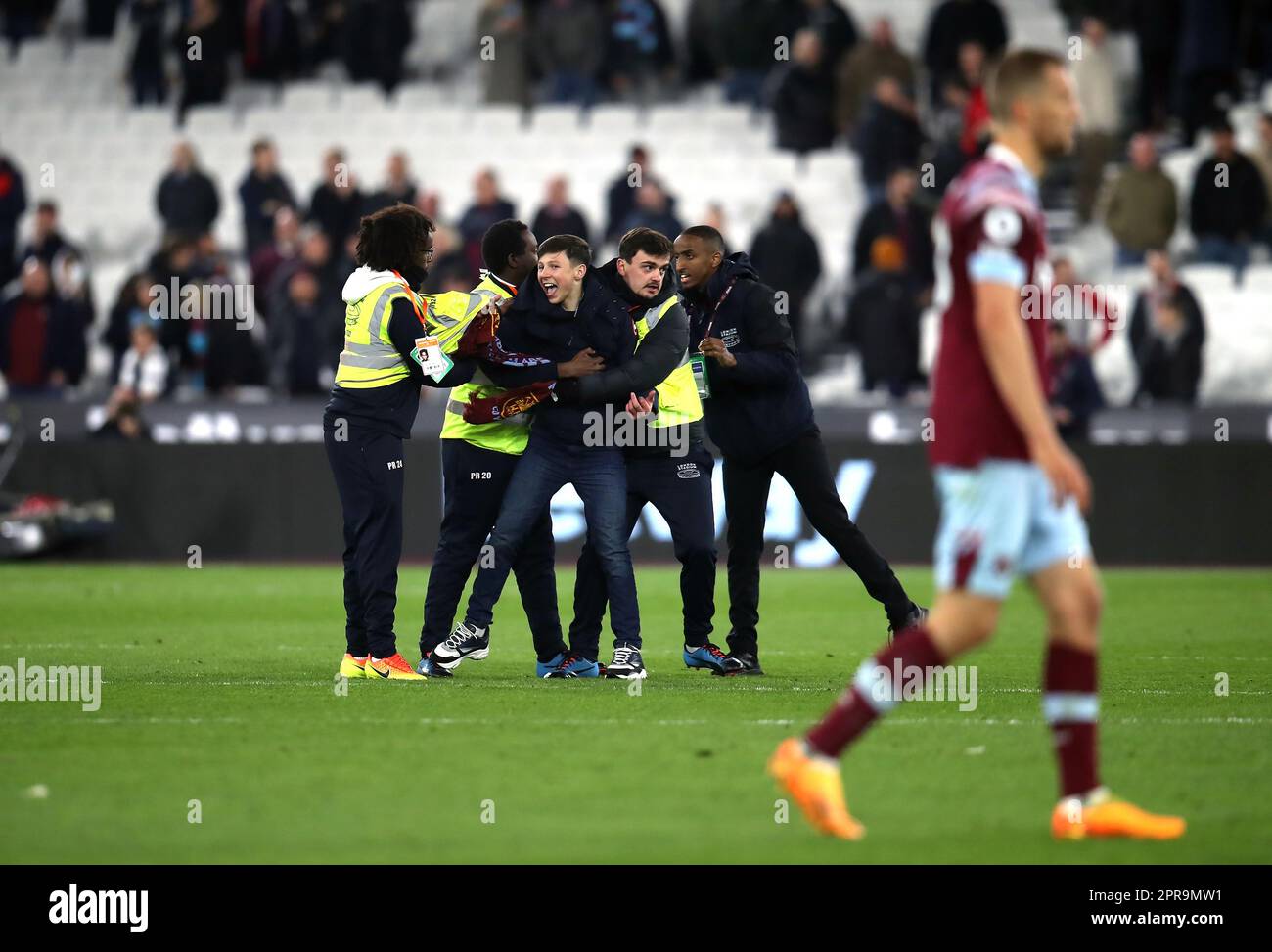 A fan invades the pitch following during the Premier League match at ...