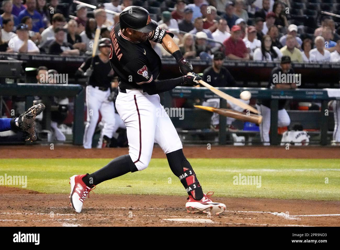 Arizona Diamondbacks' Evan Longoria breaks his bat as he hits an RBI ...