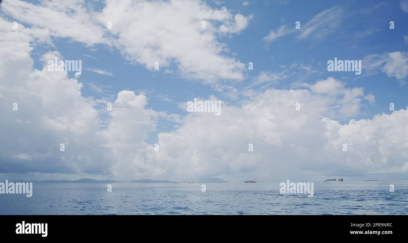 White cloud blue sky and the sea Stock Photo - Alamy