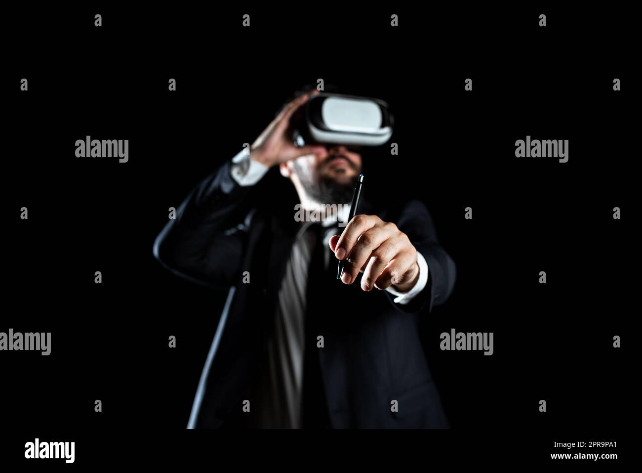Male Professional Wearing Virtual Reality Goggles Holding Pen And ...