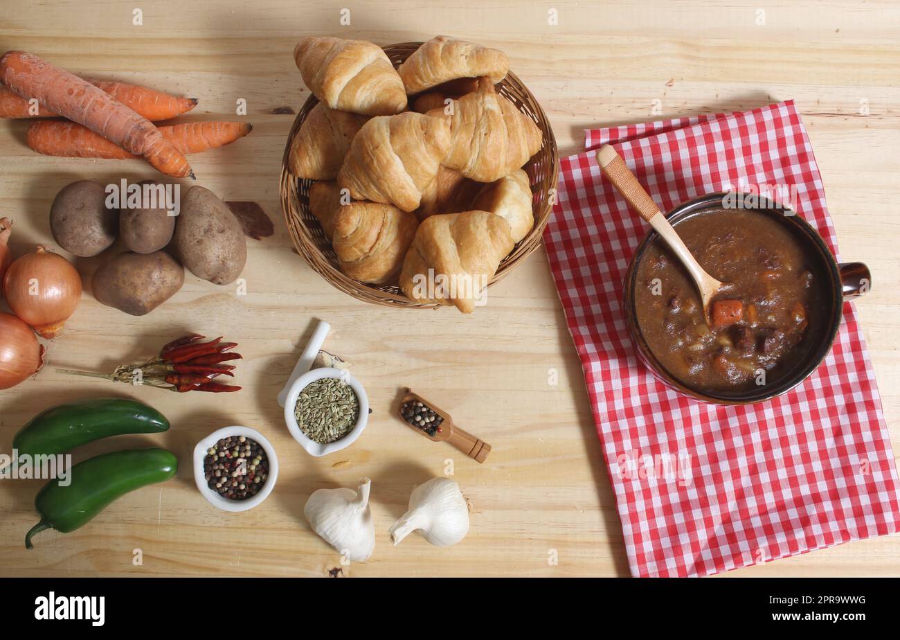 Beef Stew and Fresh Bread in Rustic Kitchen With Red and White ...