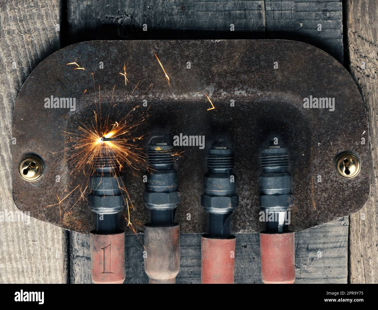 First Advent background with four spark plugs on rusty sign, car ...