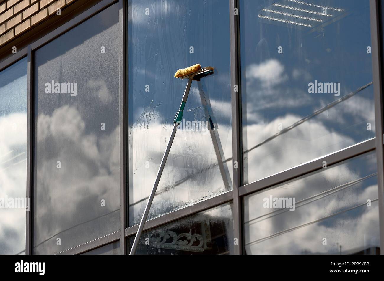 window washing, washing a street shop window Stock Photo - Alamy