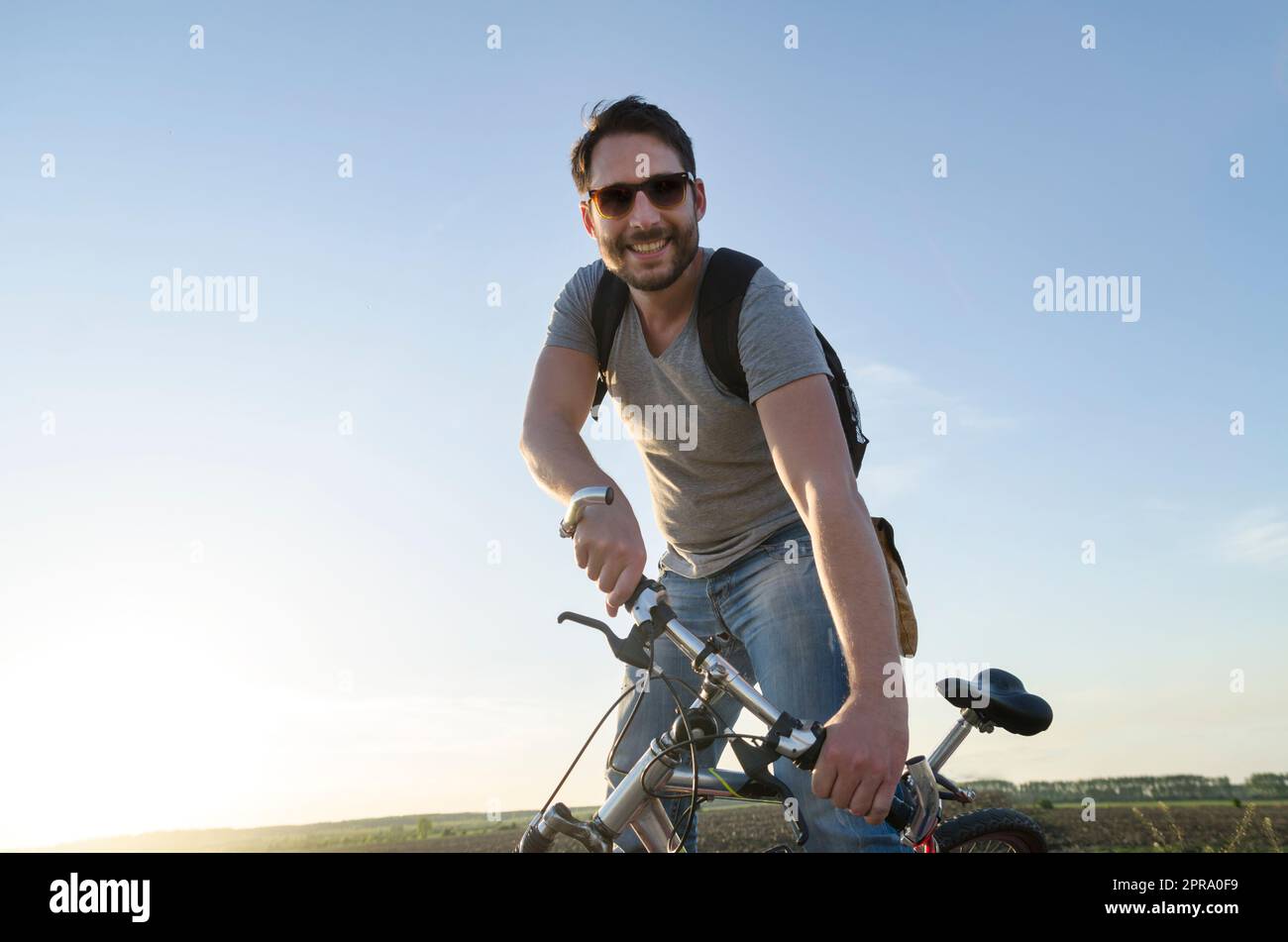 Man riding a bike Stock Photo - Alamy
