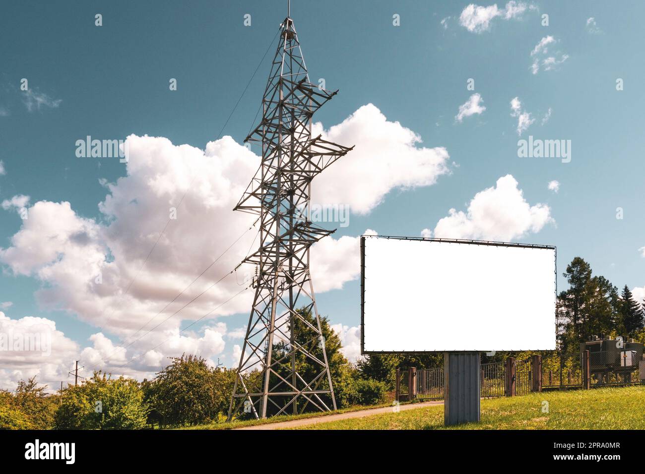 White canvas billboard next to high-voltage tower Stock Photo - Alamy