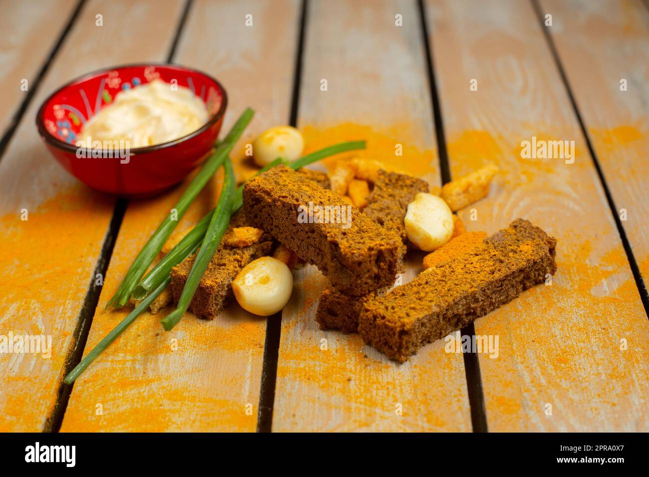 front view sliced bread rusks with garlic green onion and sour cream on ...