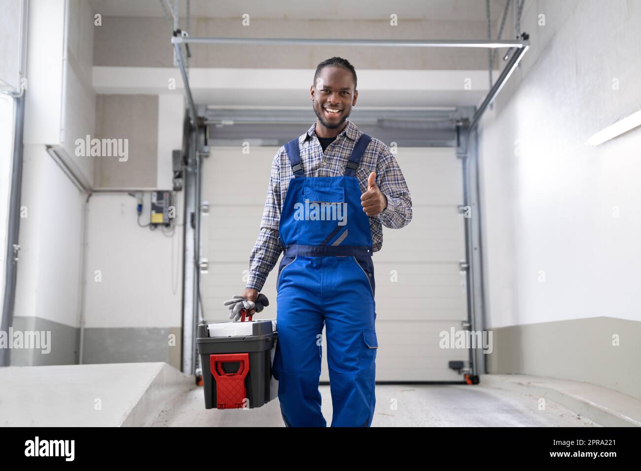 Garage Door Installer Worker Stock Photo - Alamy