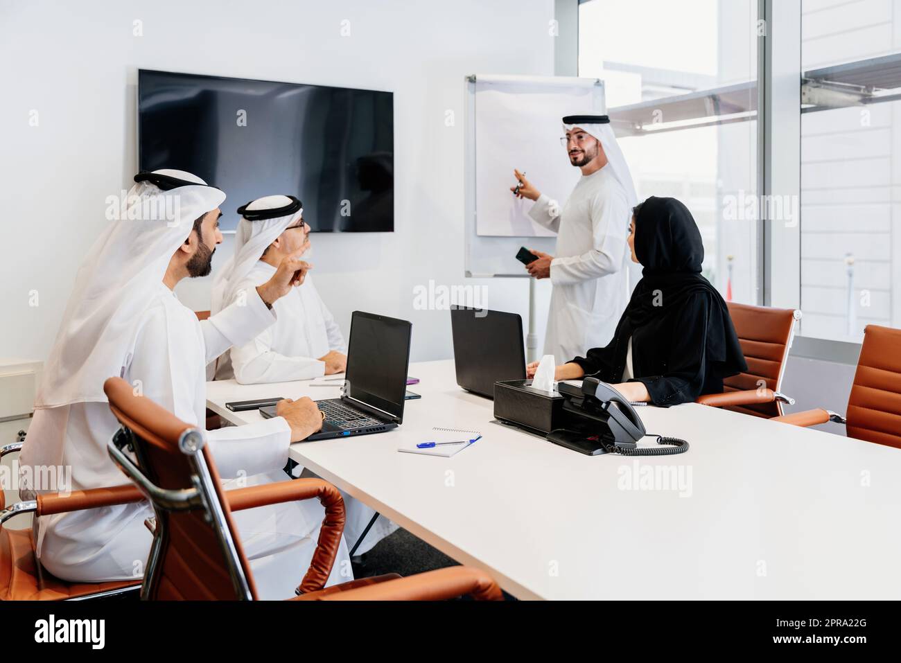 Group of middle-eastern corporate business people wearing traditional ...