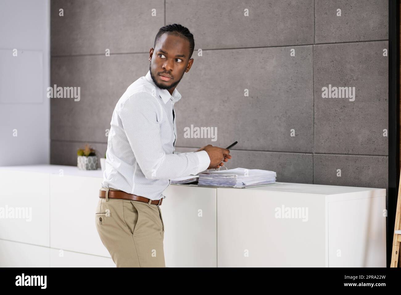 African american male employee using hi-res stock photography and ...