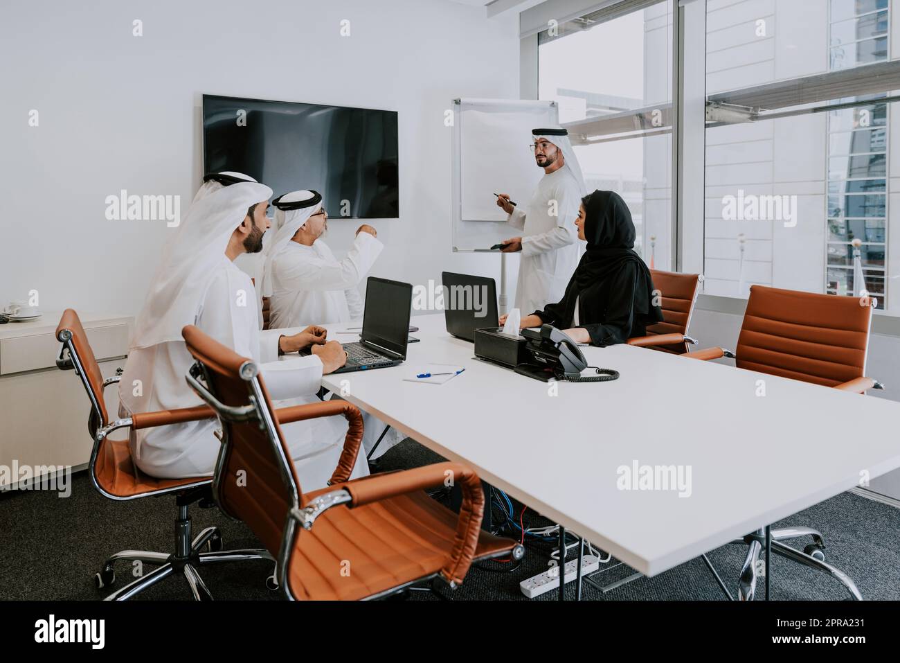 Group of middle-eastern corporate business people wearing traditional ...