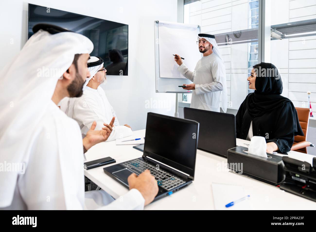 Group of middle-eastern corporate business people wearing traditional ...