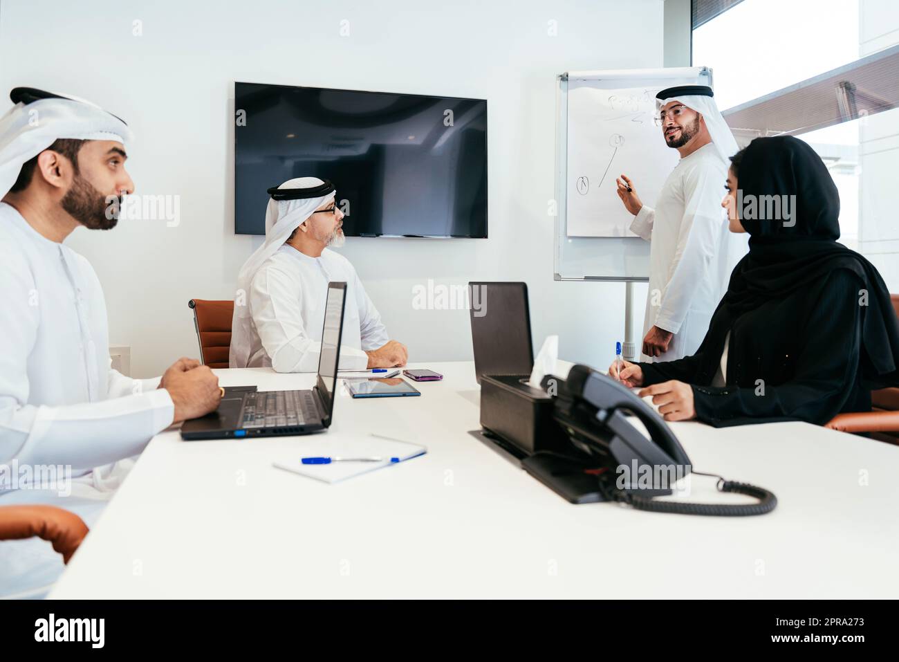 Group of middle-eastern corporate business people wearing traditional ...