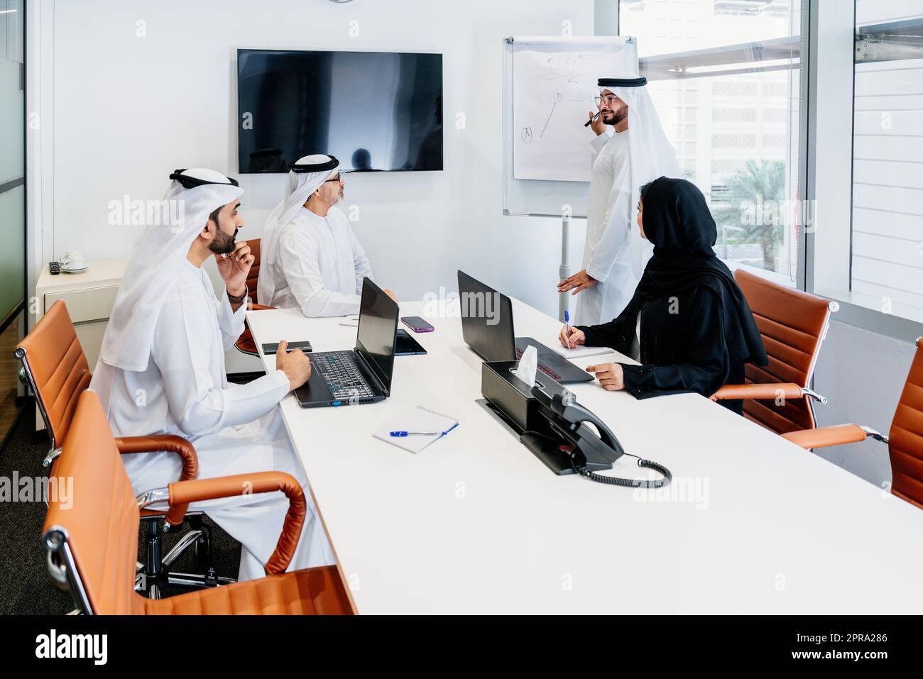 Group of middle-eastern corporate business people wearing traditional ...