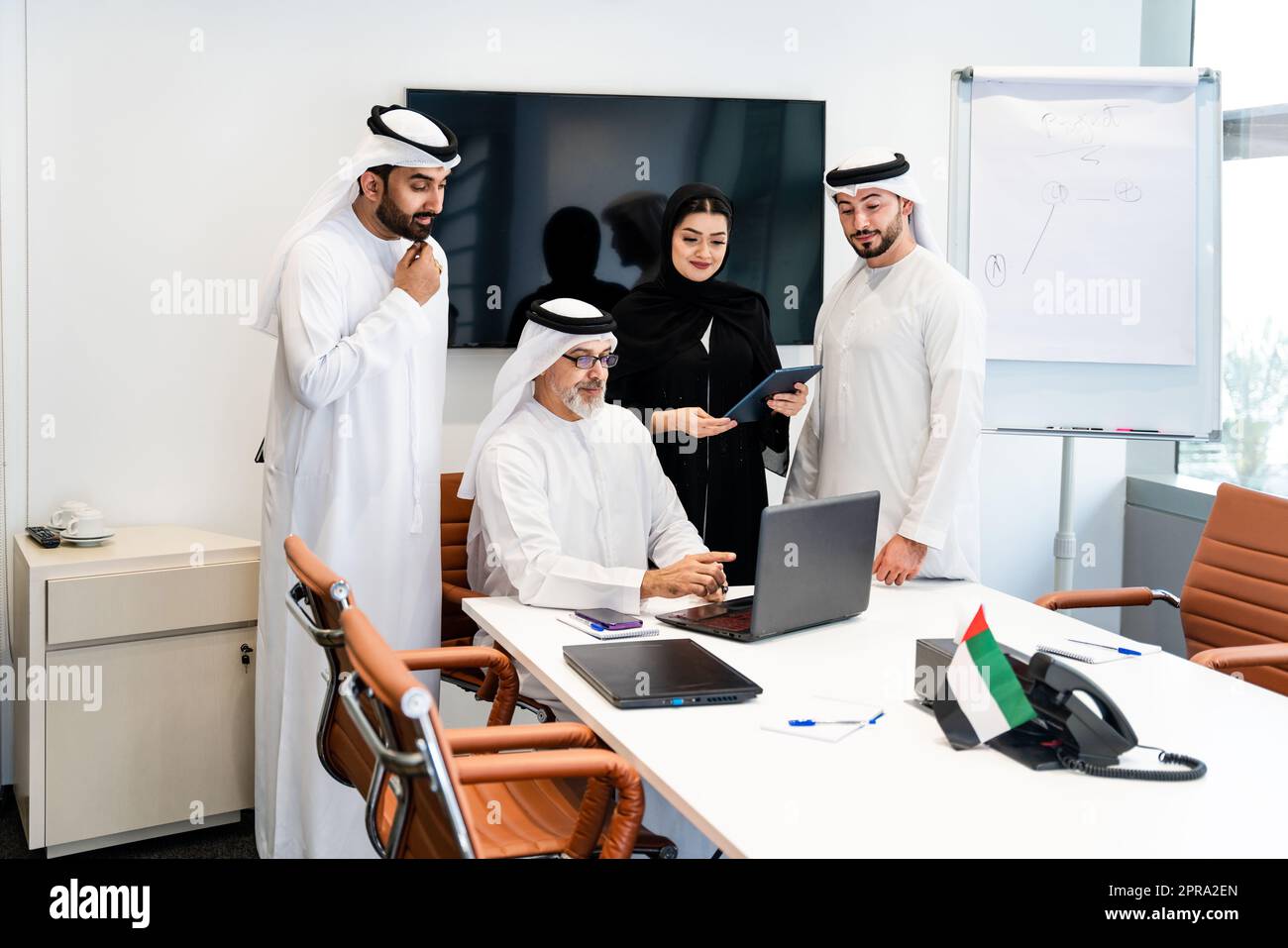 Group of middle-eastern corporate business people wearing traditional ...