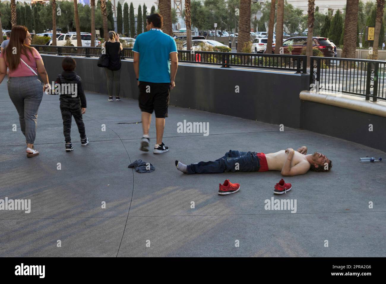 Close-up view of man sleeping on street. Drugs addiction concept. Las ...