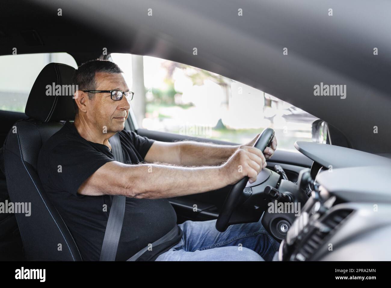 Senior in his 70s driving a car Stock Photo - Alamy