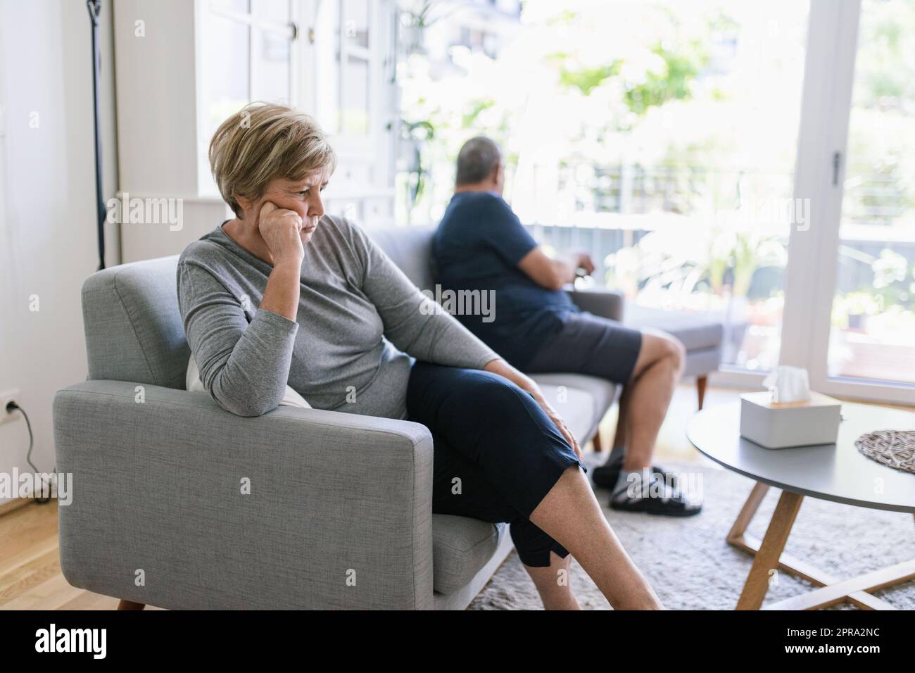 Upset senior couple at home having an argument Stock Photo - Alamy