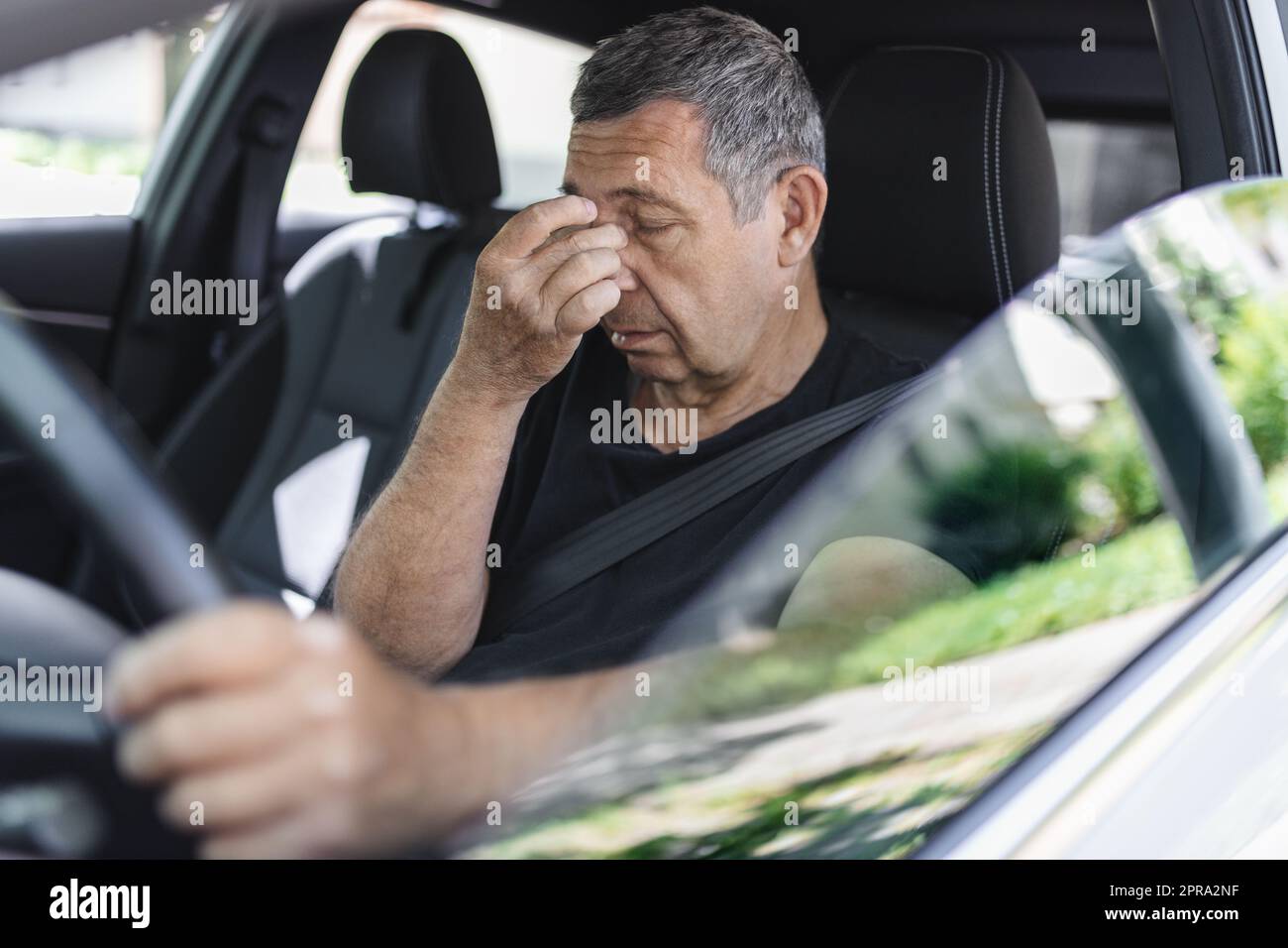 Tired person at wheel of car hi-res stock photography and images - Alamy
