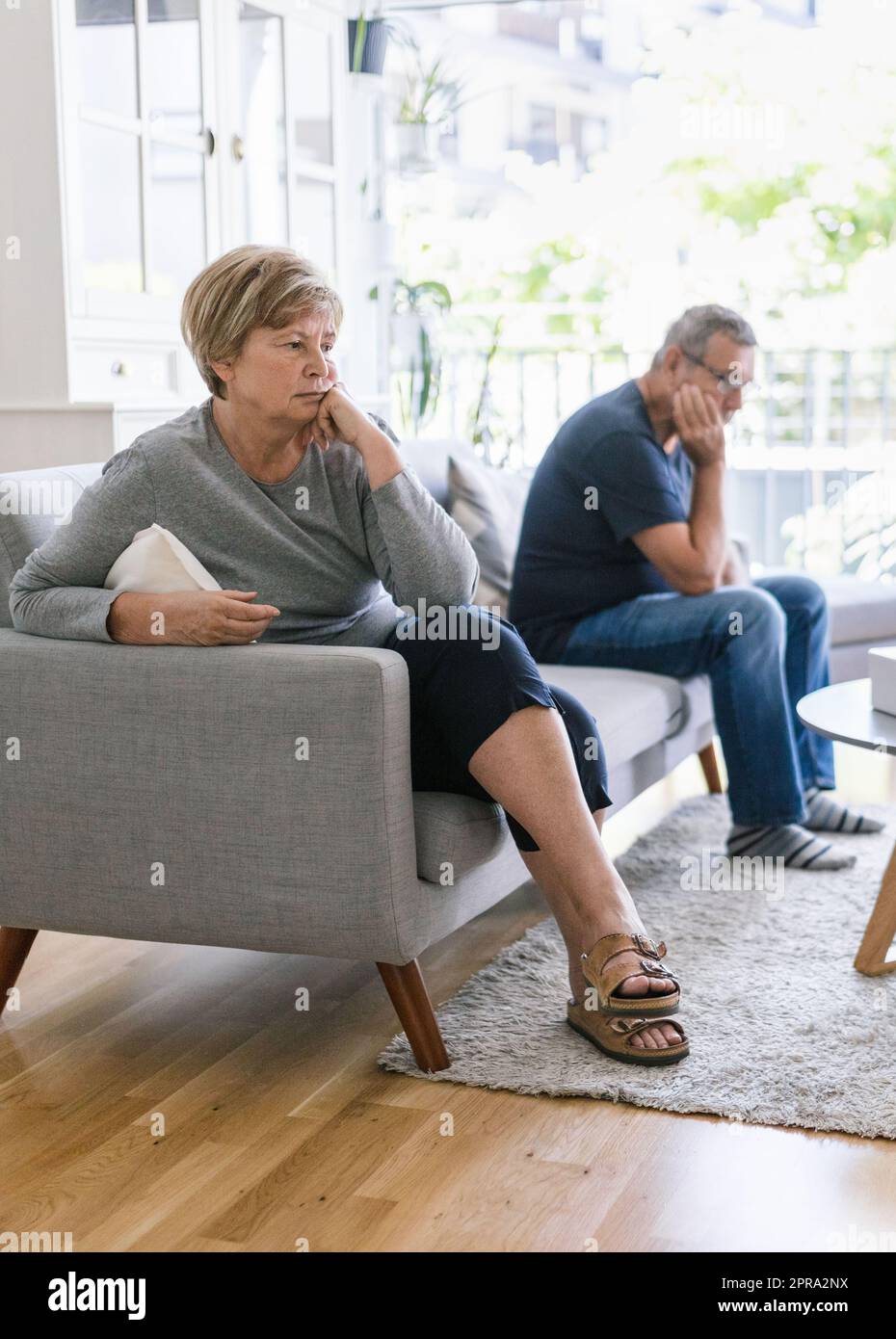 Upset senior couple at home having an argument Stock Photo - Alamy