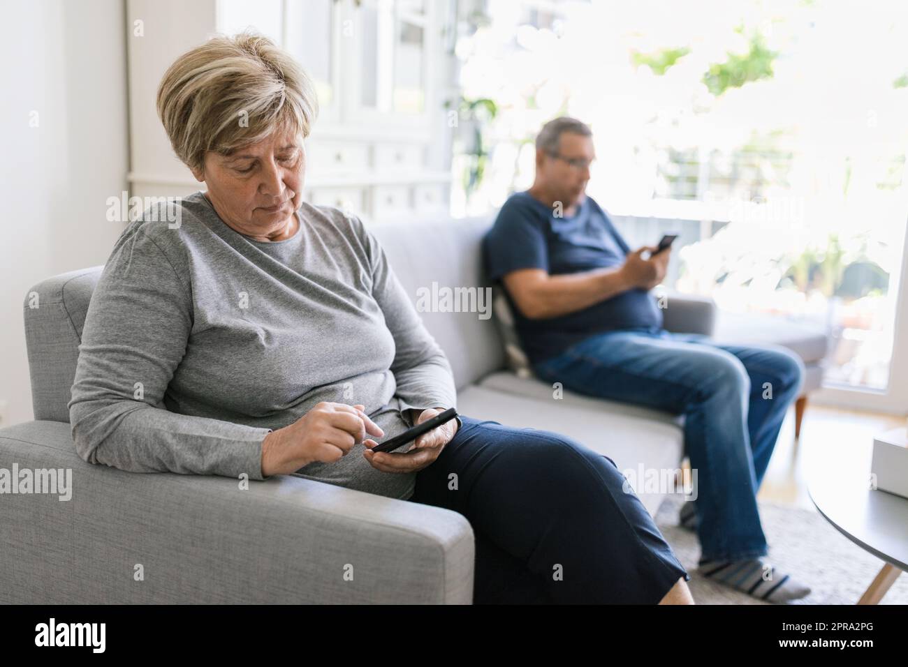Family using phones hi-res stock photography and images - Alamy