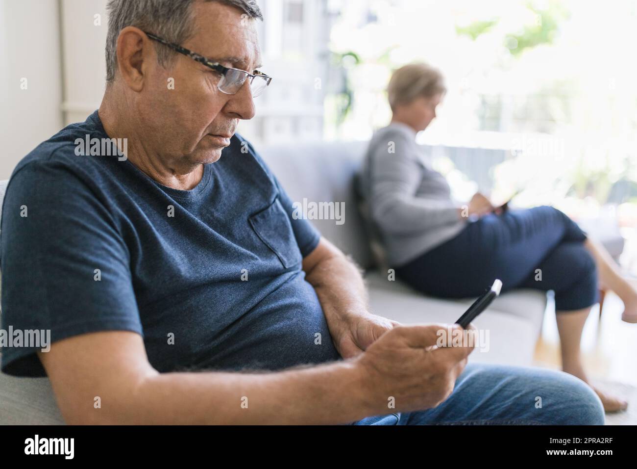 Family using phones hi-res stock photography and images - Alamy