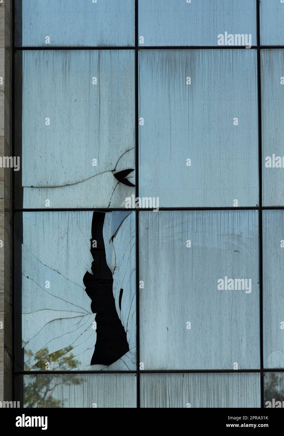 Broken windows in a modern building on the urban area Stock Photo - Alamy