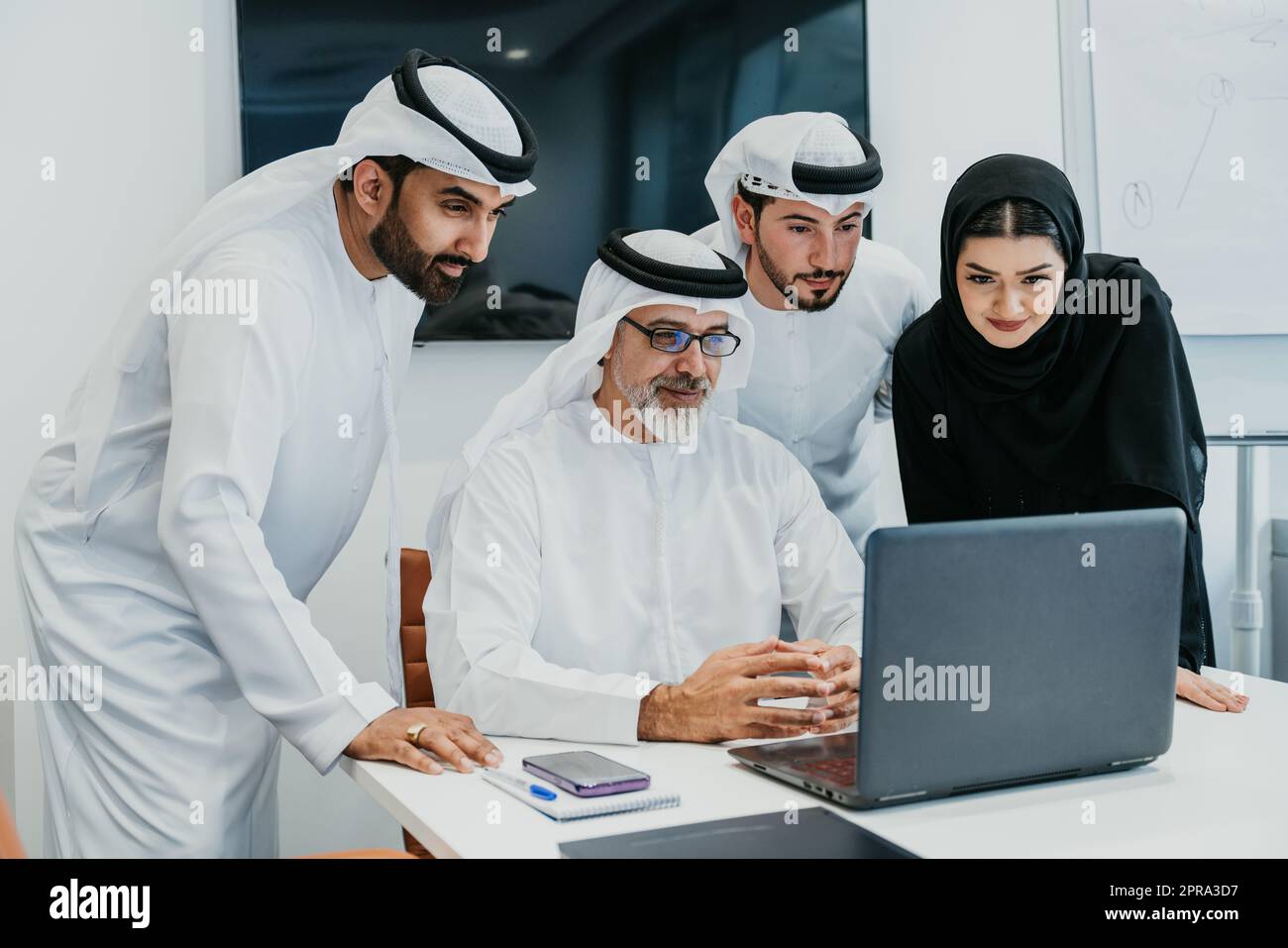 Group of middle-eastern corporate business people wearing traditional ...