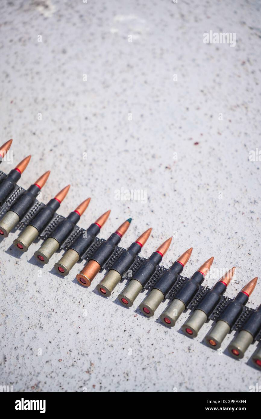 Machine gun belt loaded with cartridges Stock Photo - Alamy